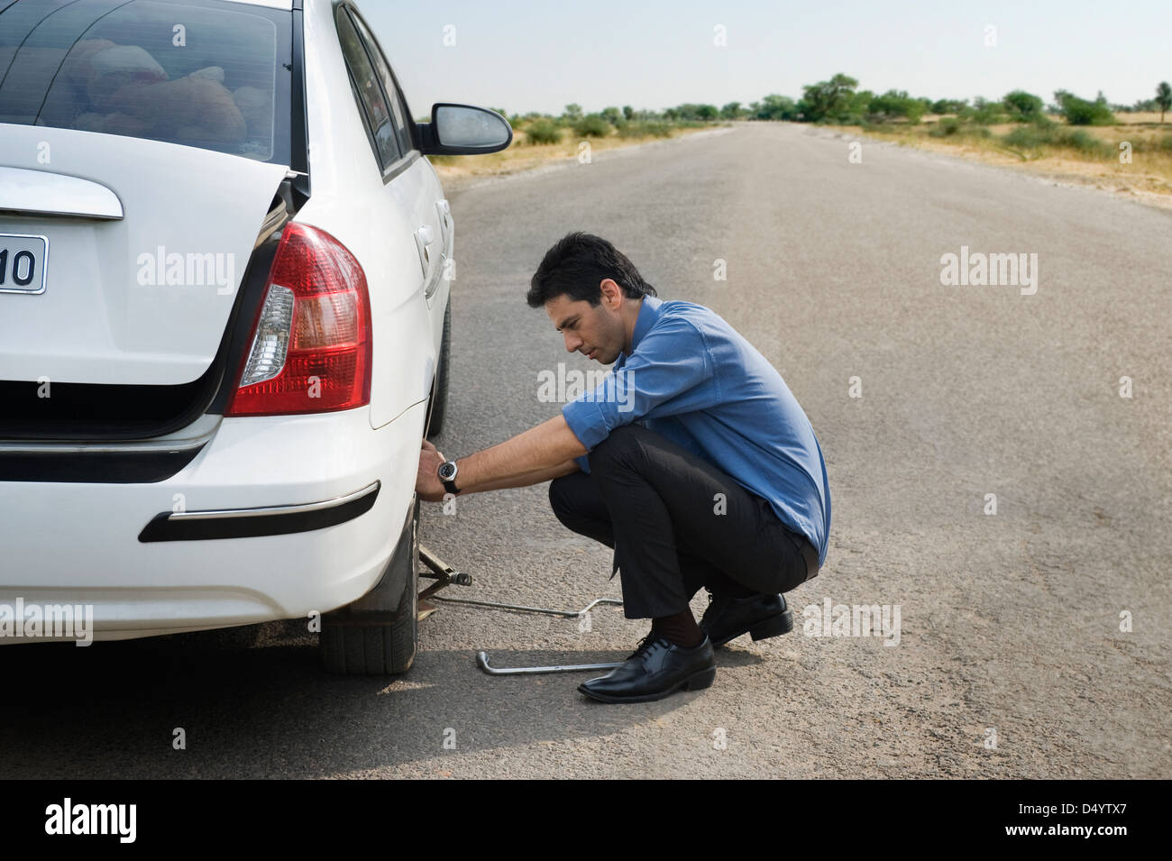 Car punctured hi-res stock photography and images - Alamy