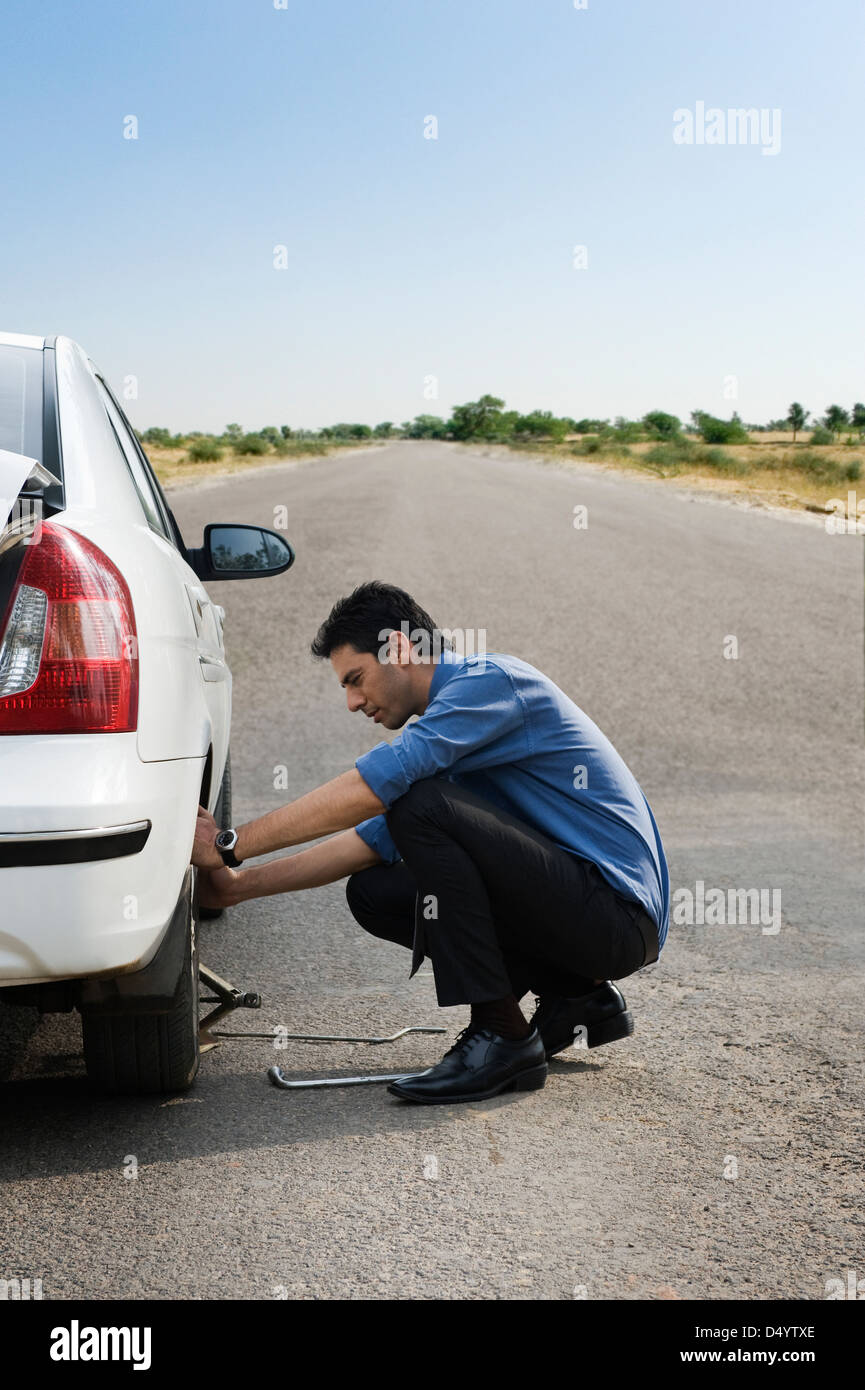 Car punctured hi-res stock photography and images - Alamy