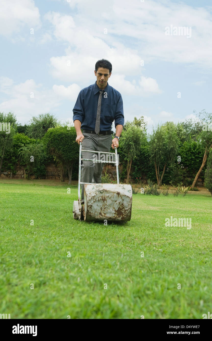 Man using lawn mower in hi-res stock photography and images - Alamy