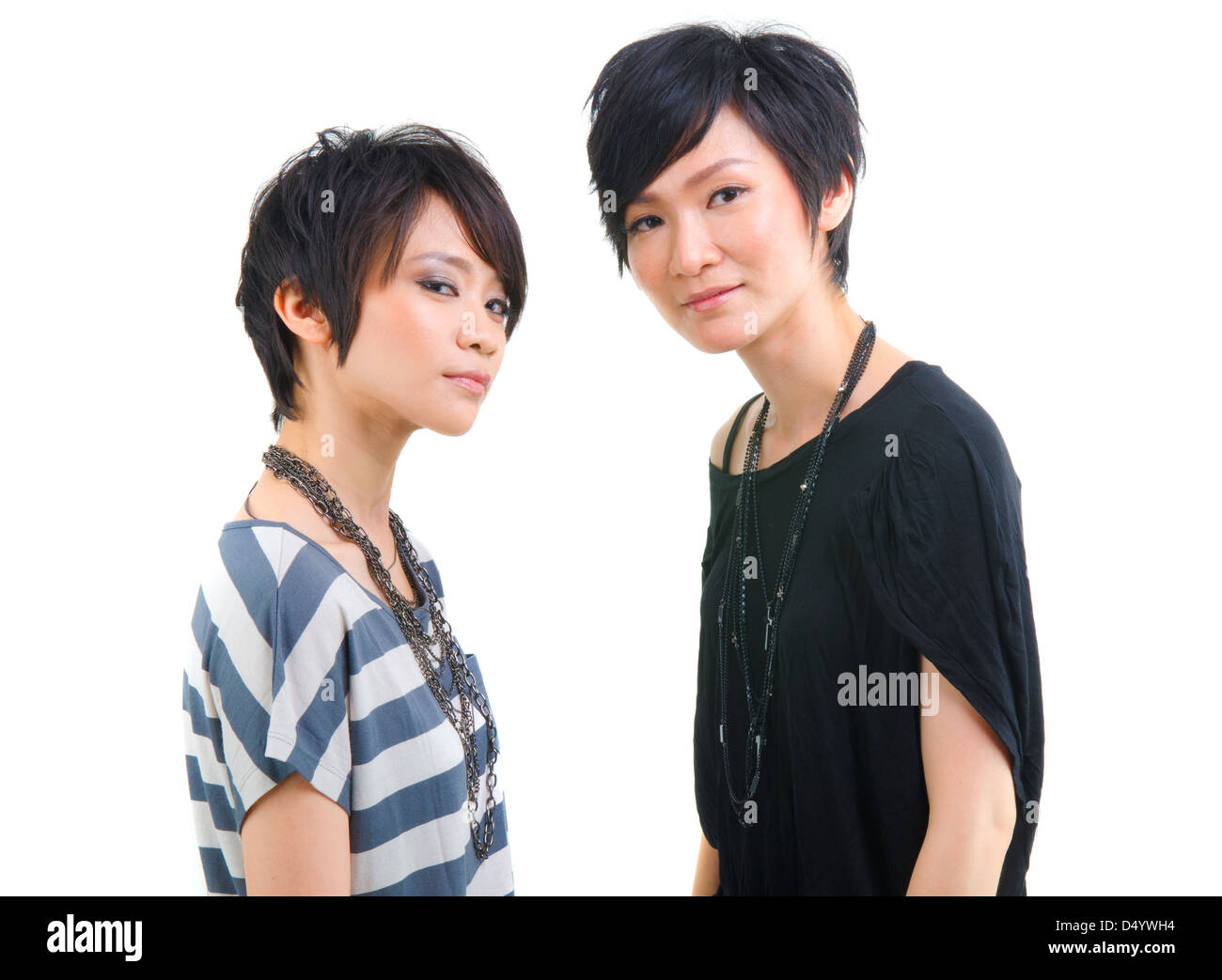 korean sisters girls with isolated white background Stock Photo - Alamy