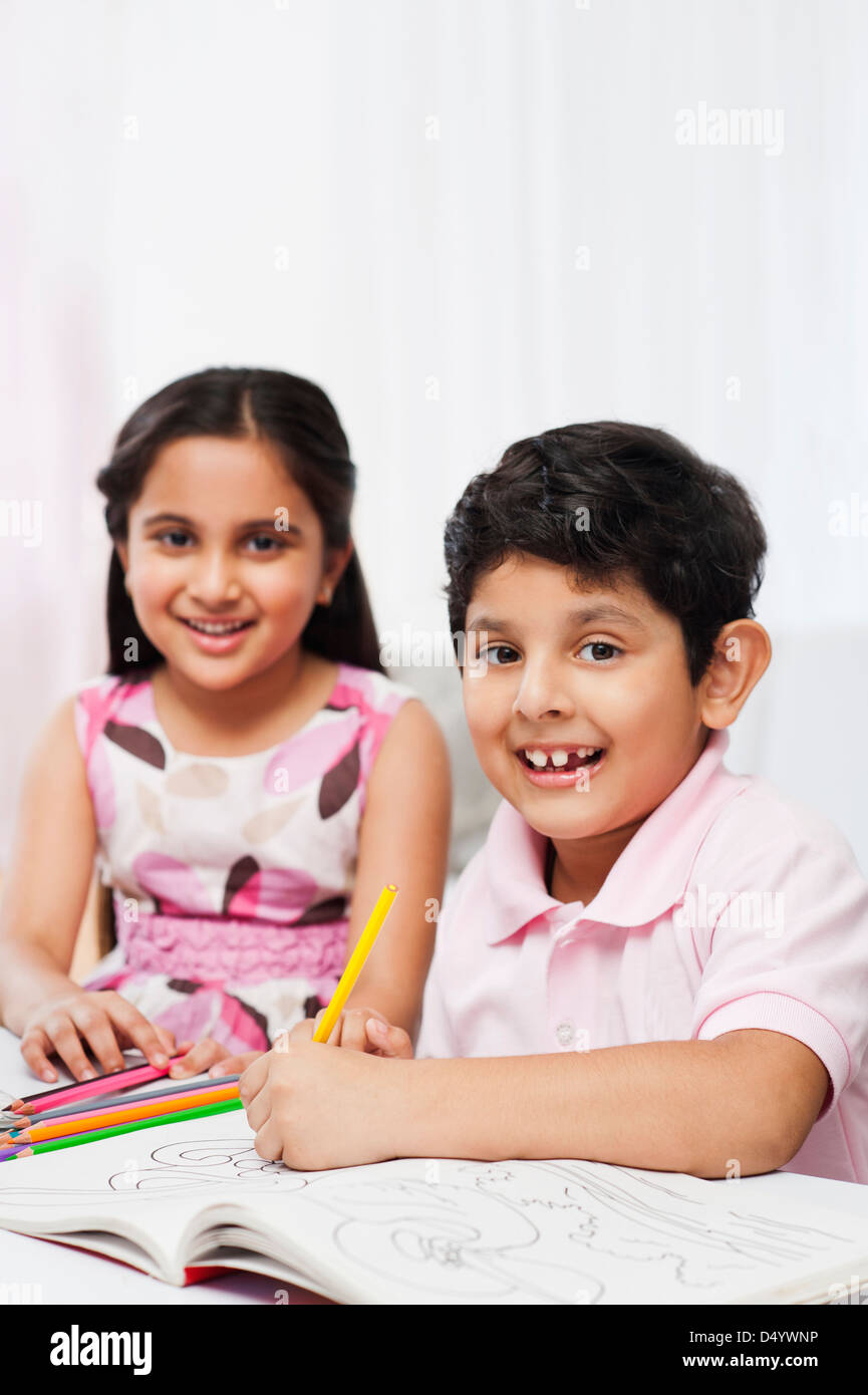 Children making drawings with colored pencils Stock Photo - Alamy