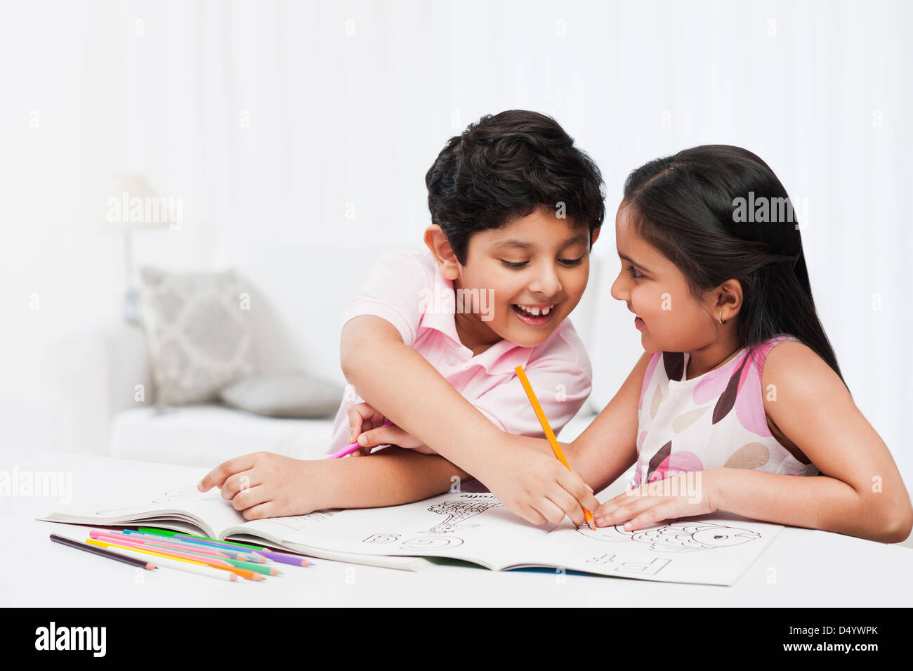 Children making drawings with colored pencils Stock Photo - Alamy