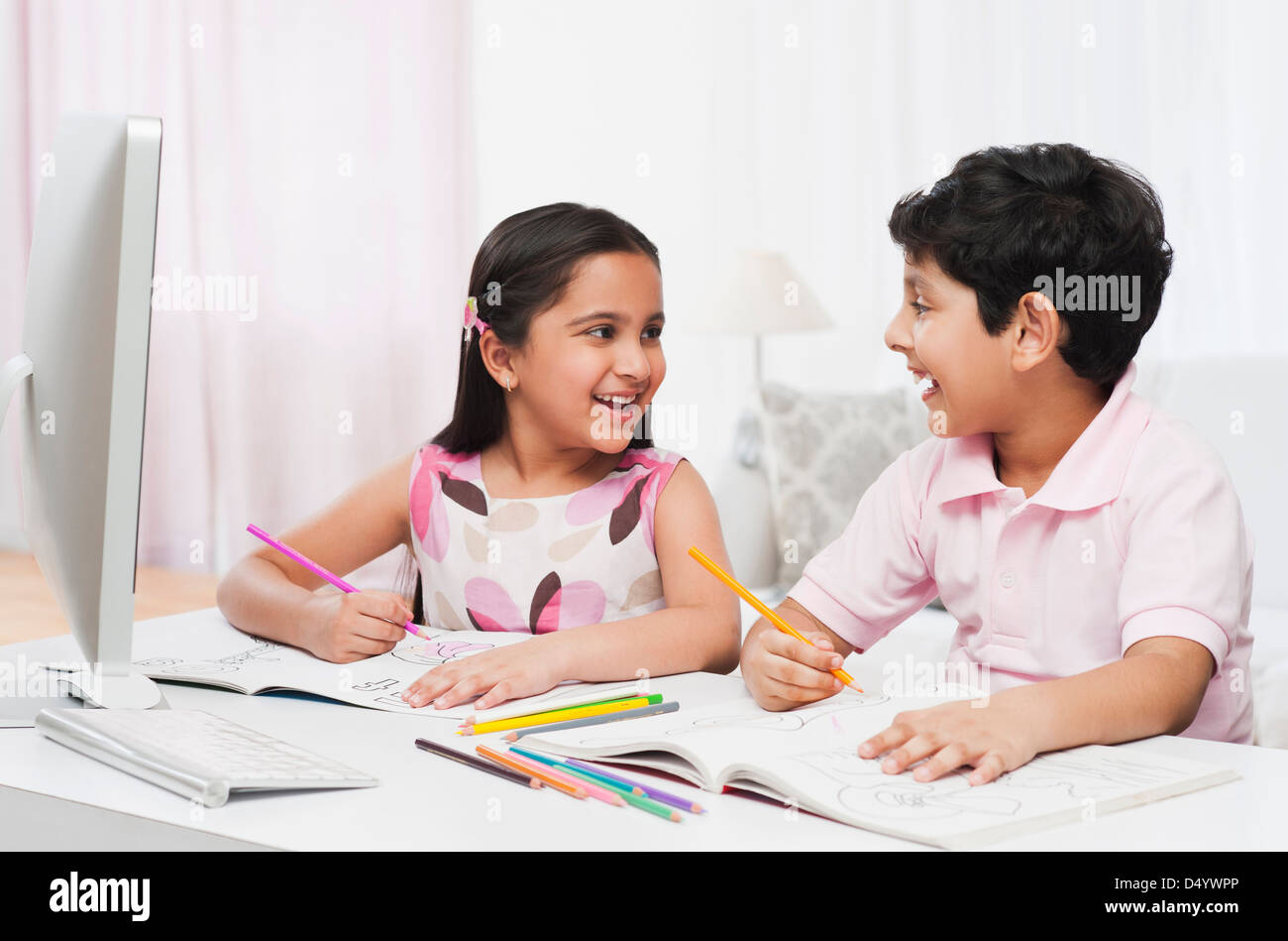Children making drawings with colored pencils Stock Photo - Alamy