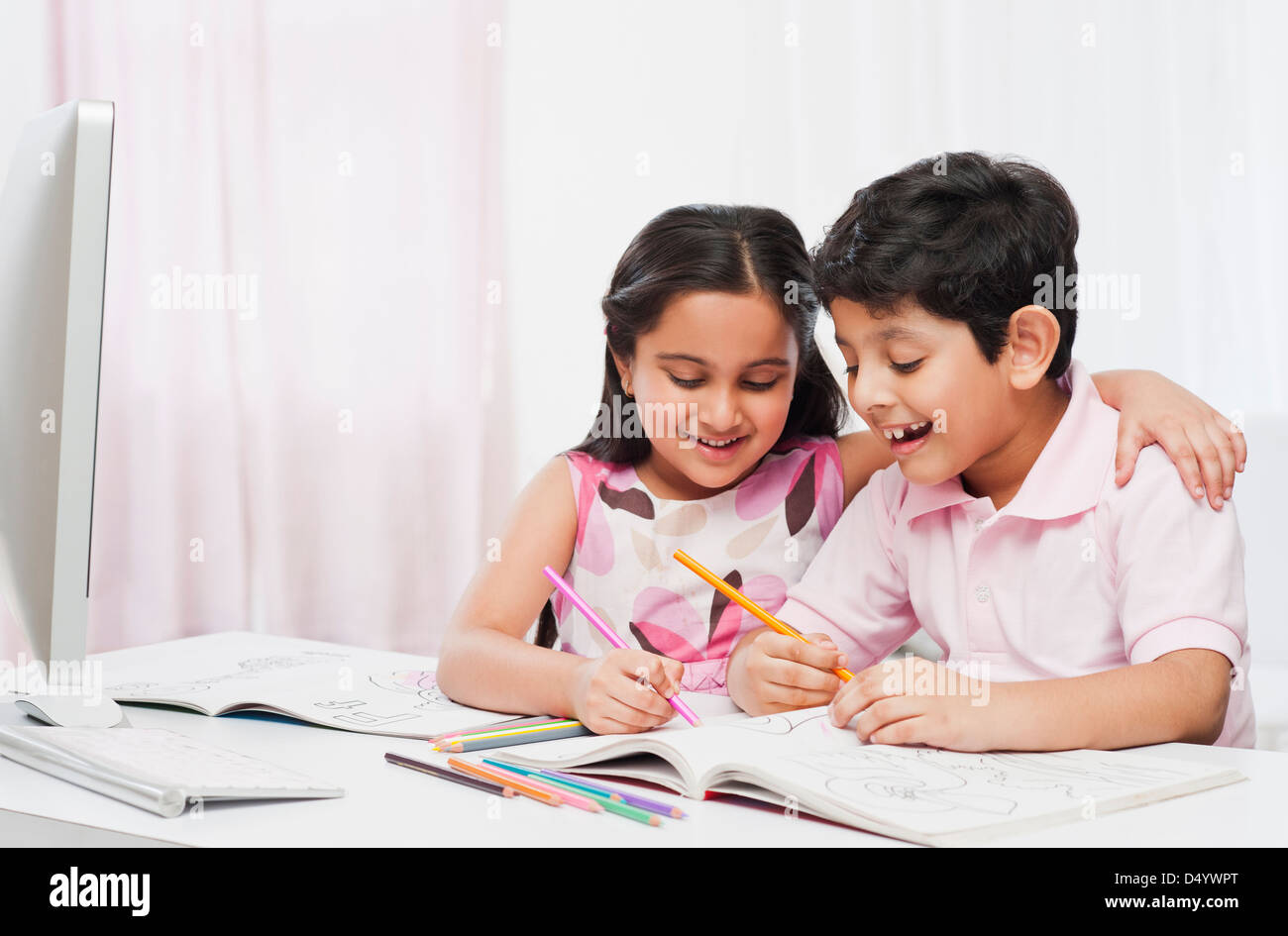 Children making drawings with colored pencils Stock Photo - Alamy