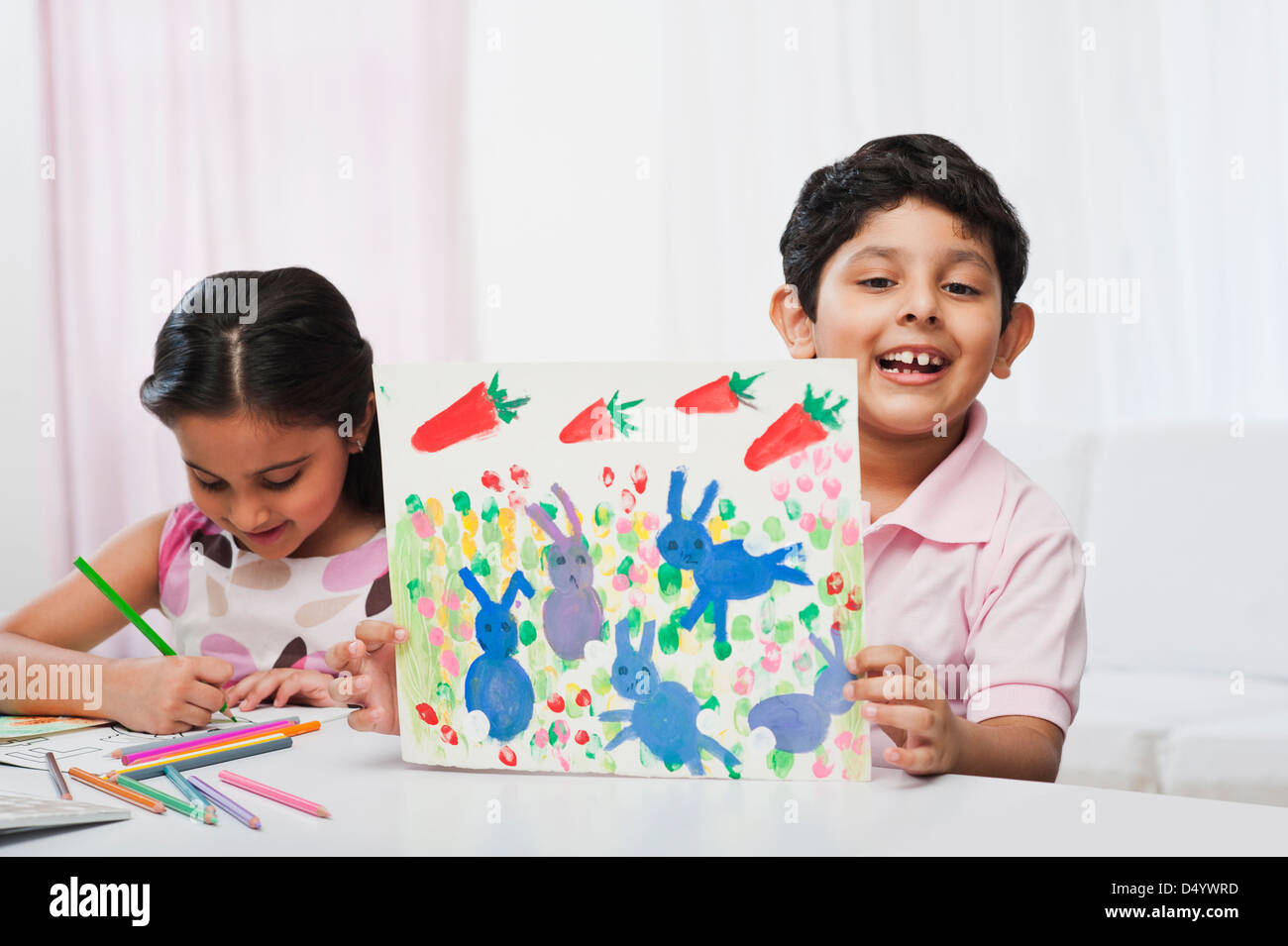 Children making drawings with colored pencils Stock Photo - Alamy