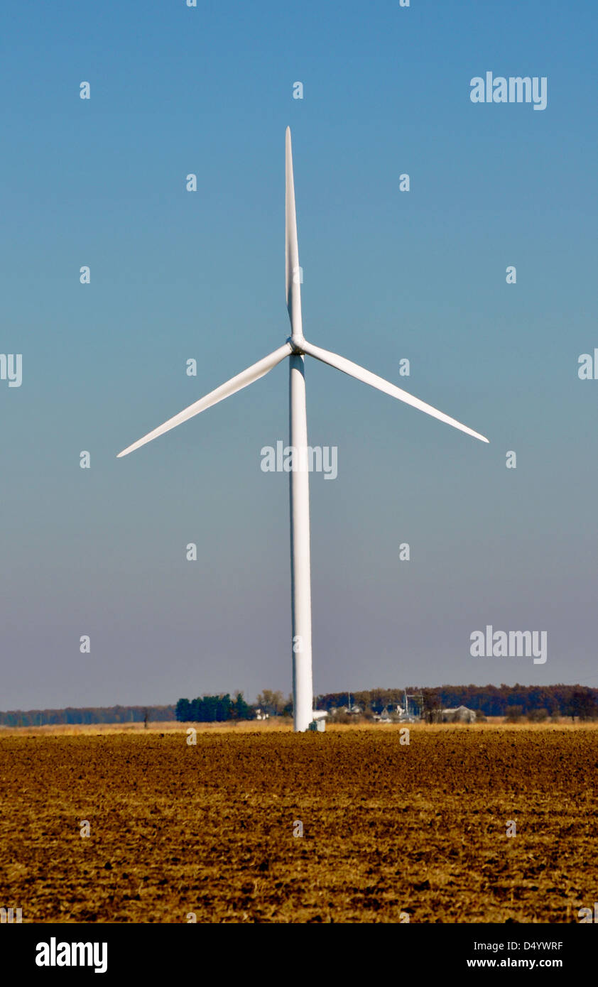 A windmill farm rotates over a Northwestern Indiana farm field Stock ...