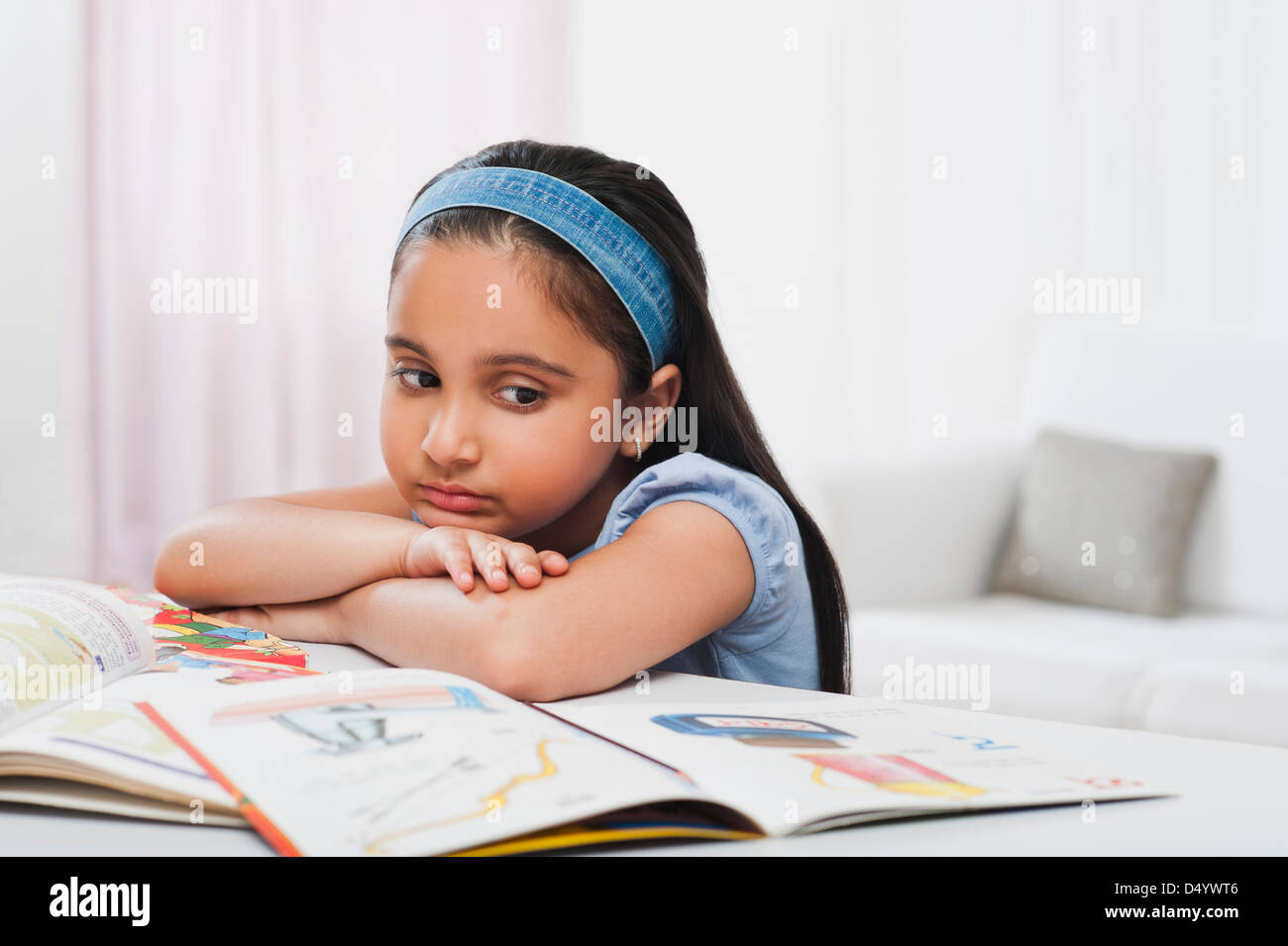 Girl reading books Stock Photo - Alamy