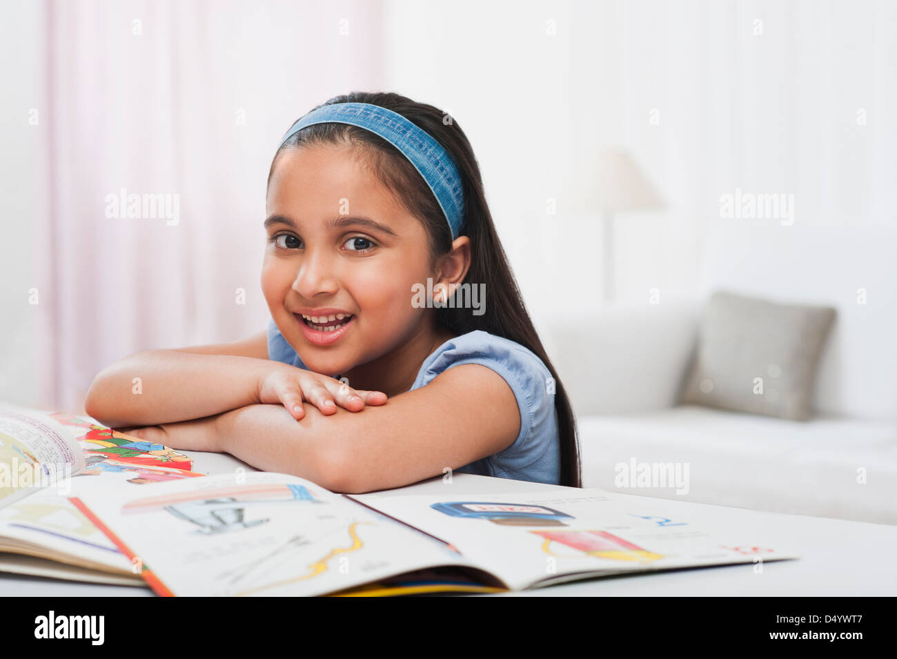 Girl reading books Stock Photo - Alamy