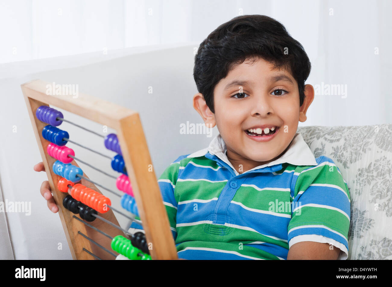 Boy using an abacus Stock Photo - Alamy