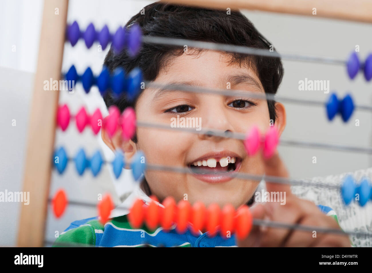 Boy using an abacus Stock Photo - Alamy