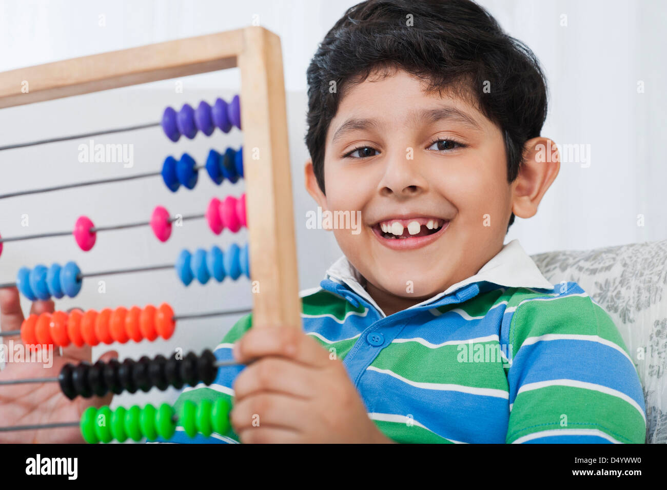 Boy using an abacus Stock Photo - Alamy