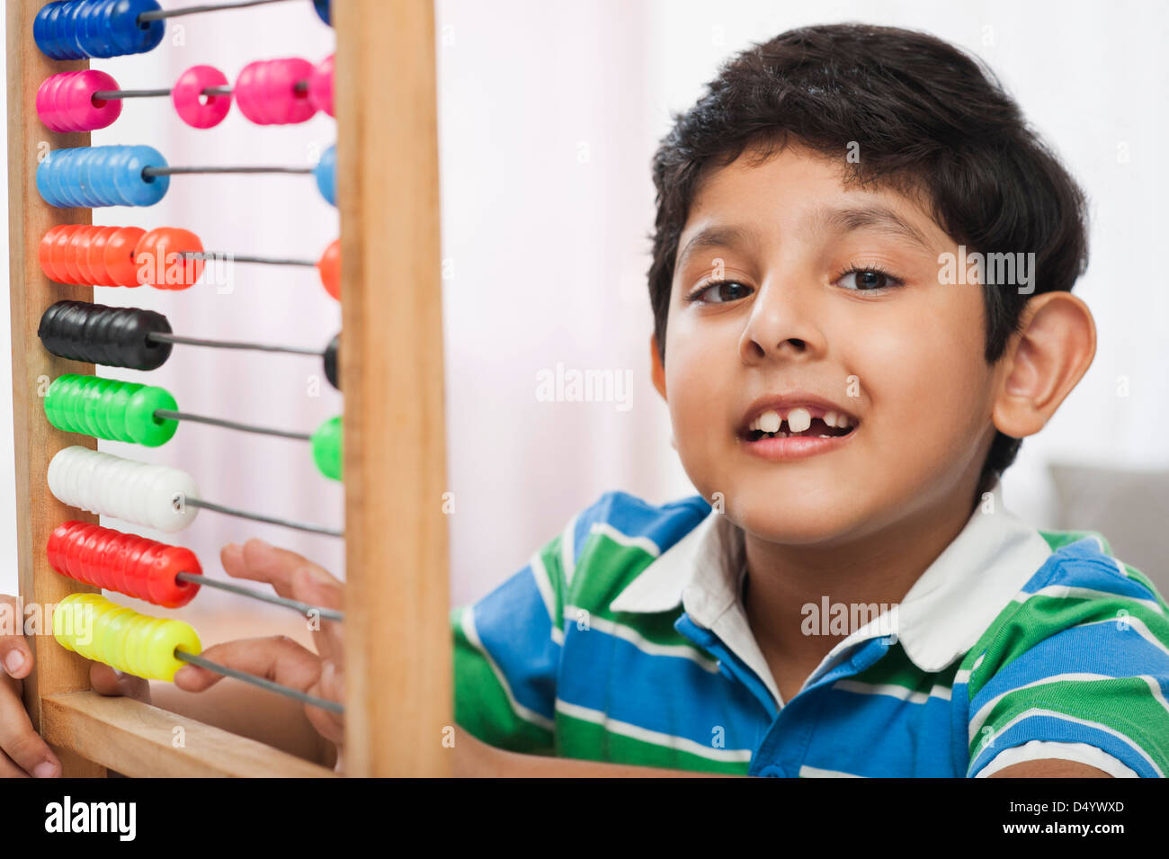 Boy using an abacus Stock Photo - Alamy