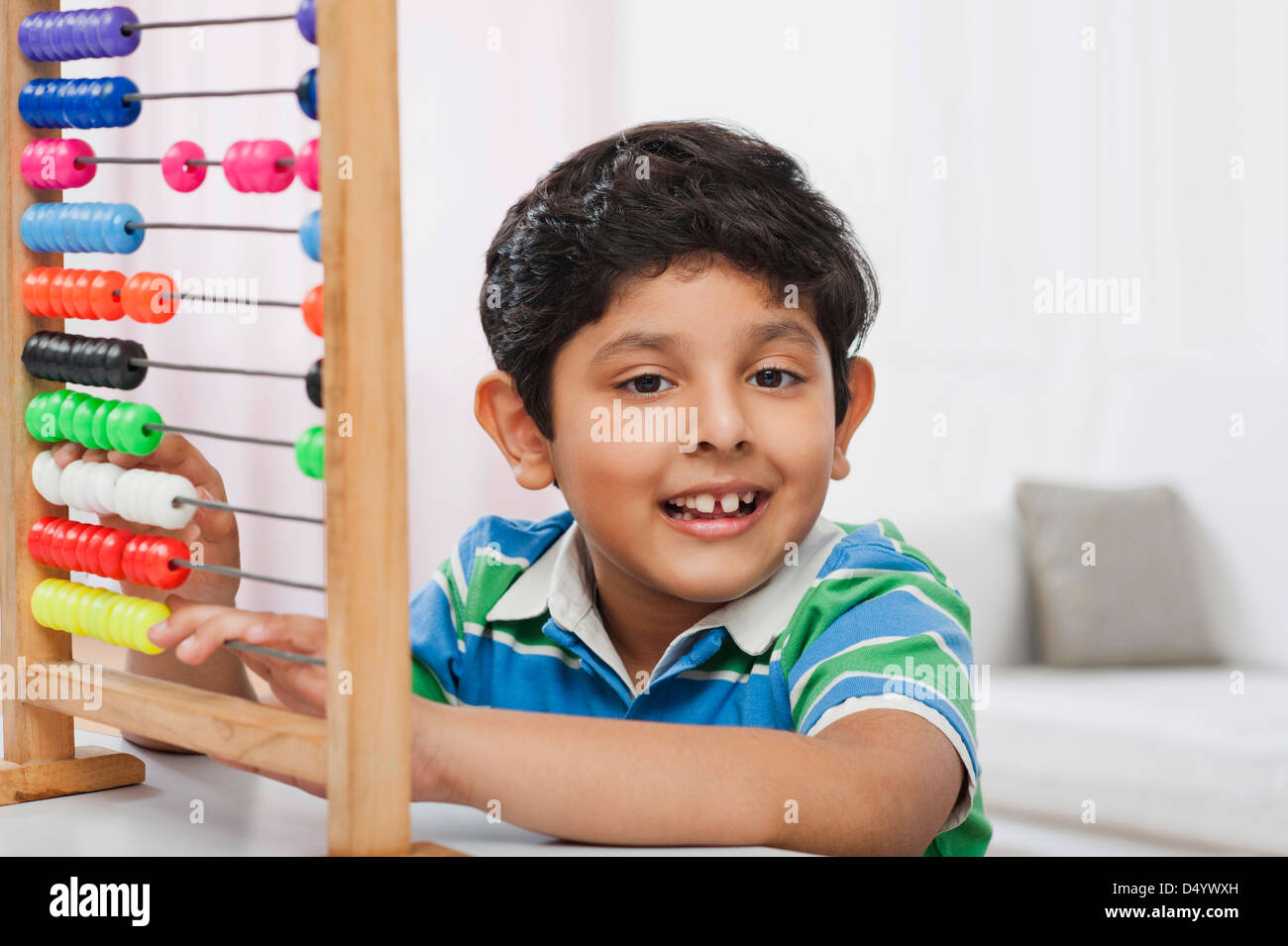 Boy using an abacus Stock Photo - Alamy