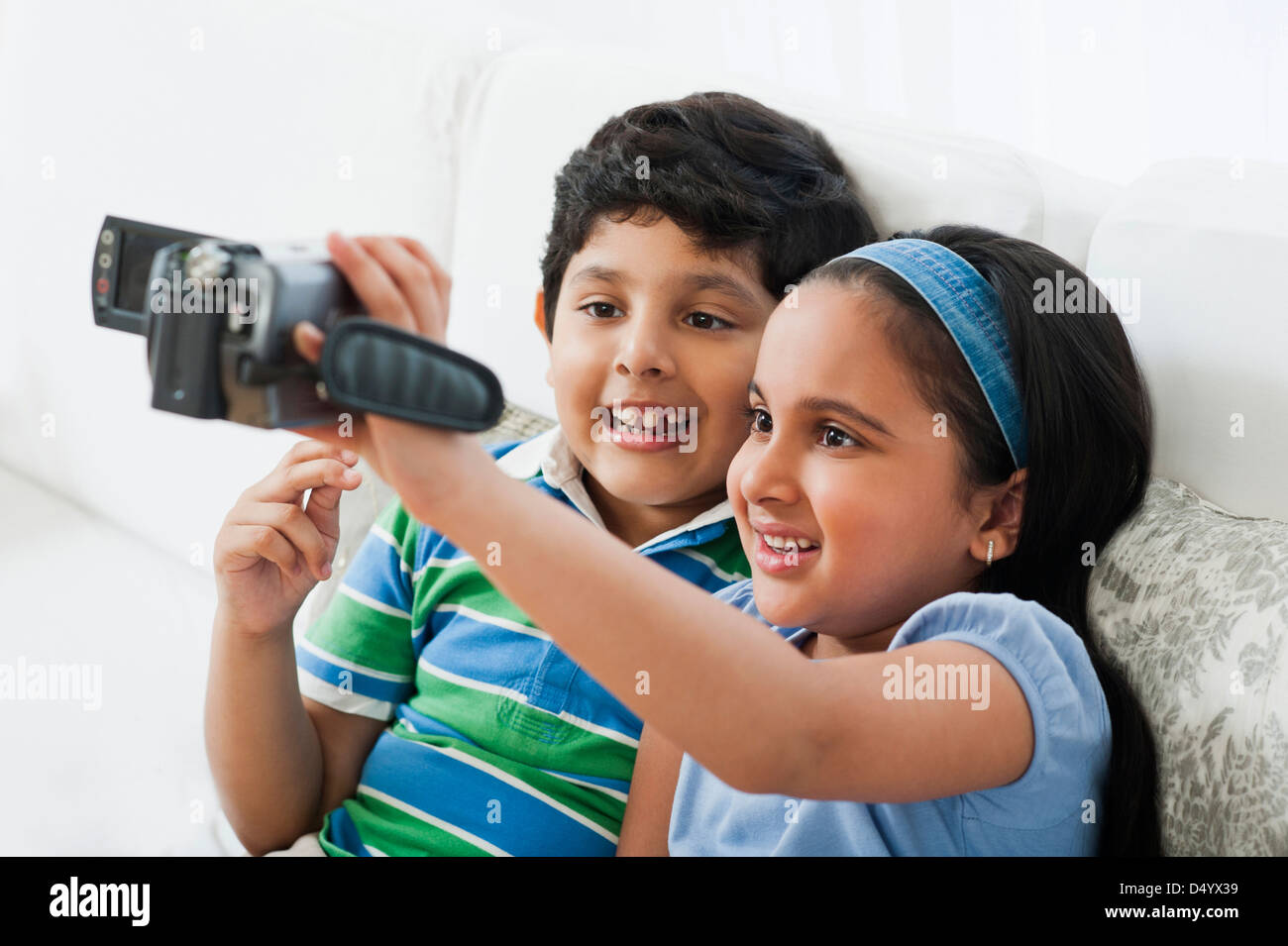 Children filming themselves with a video camera Stock Photo - Alamy