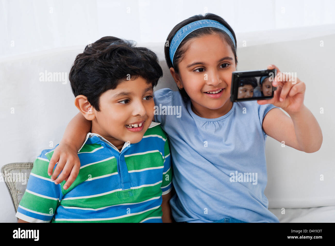 Children taking a picture of themselves with a camera Stock Photo - Alamy