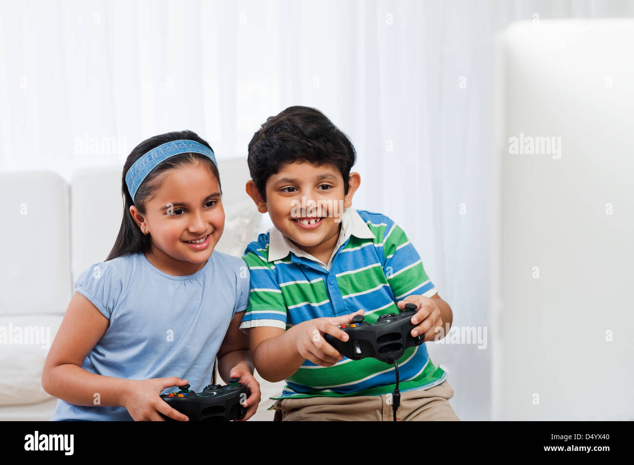 Children playing video game Stock Photo - Alamy