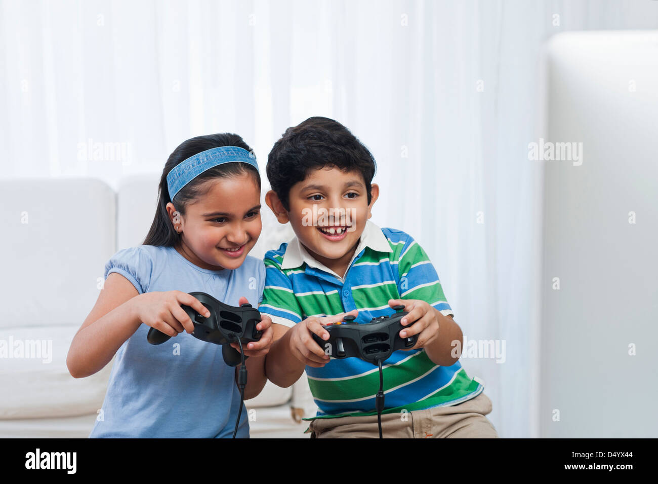 Children playing video game Stock Photo - Alamy