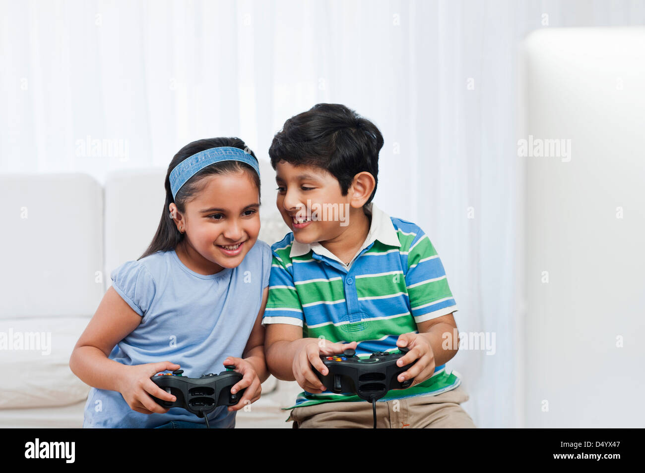Children playing video game Stock Photo - Alamy