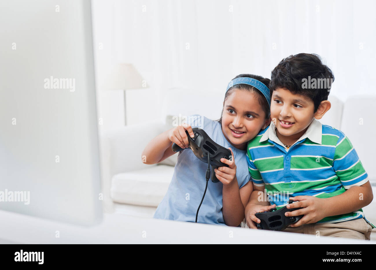 Children playing video game Stock Photo - Alamy