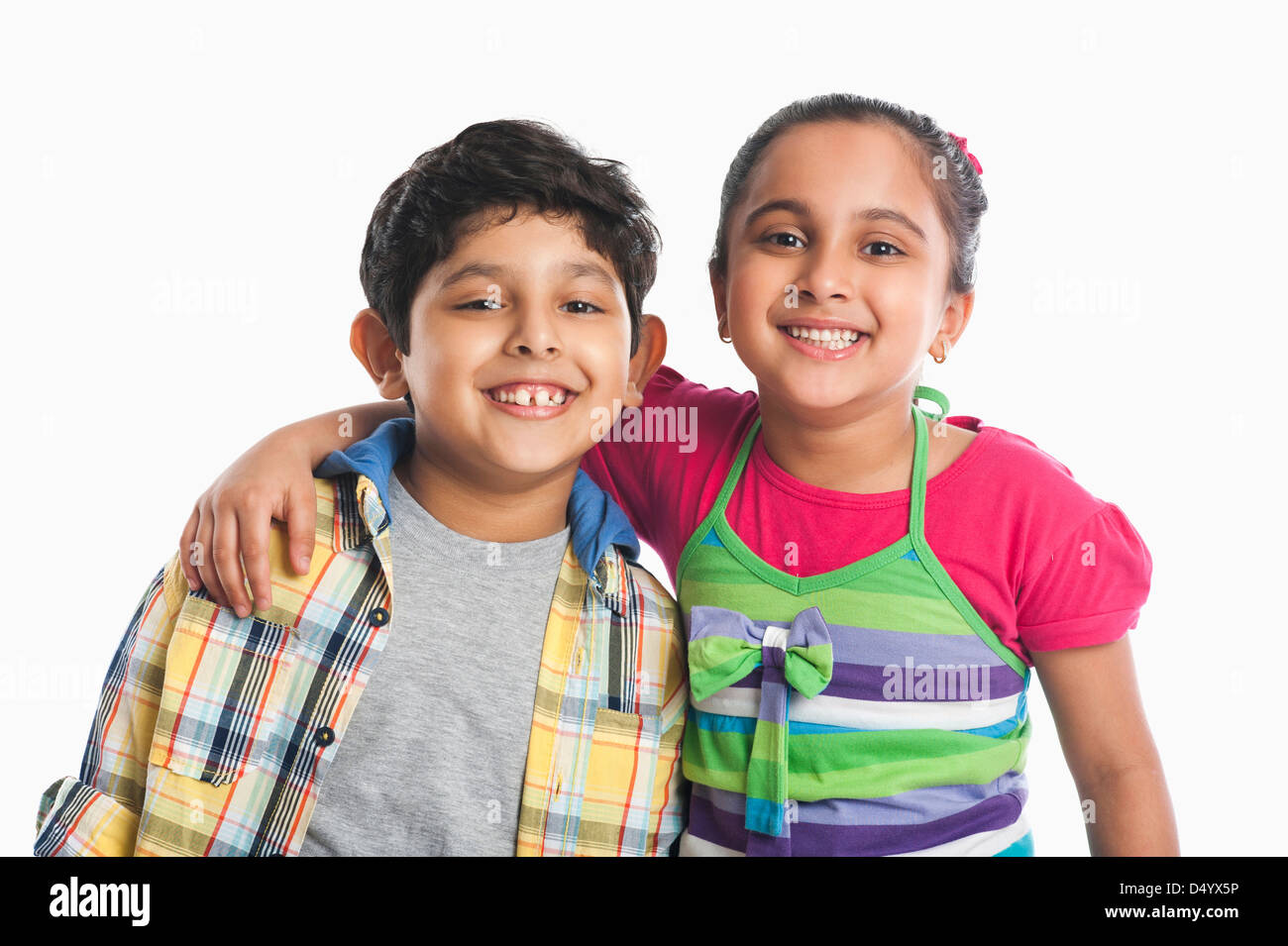 Smiling children standing arm Cut Out Stock Images & Pictures - Alamy