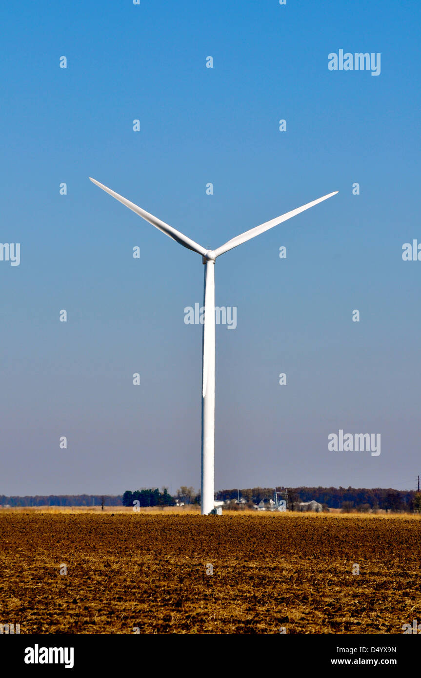 A windmill farm rotates over a Northwestern Indiana farm field Stock ...