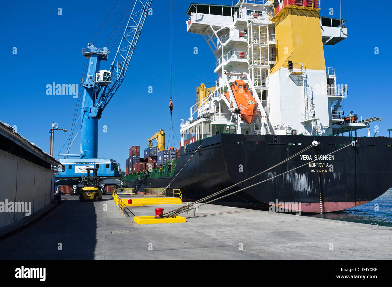 Cargo ship being unloaded while at the docks in Castries, St Lucia ...