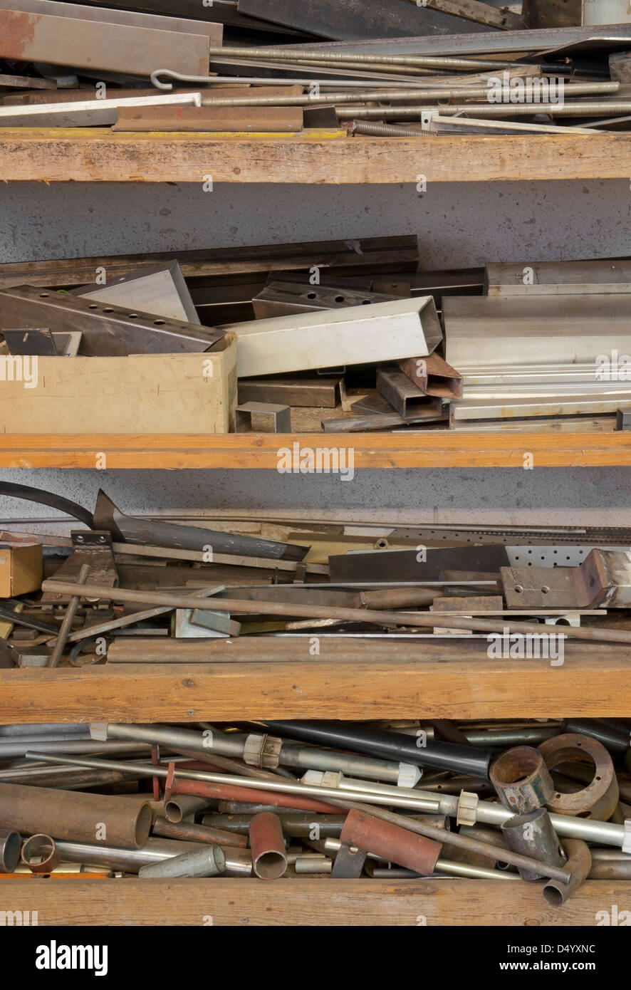 full frame detail of a rack with discarded metal pieces Stock Photo - Alamy