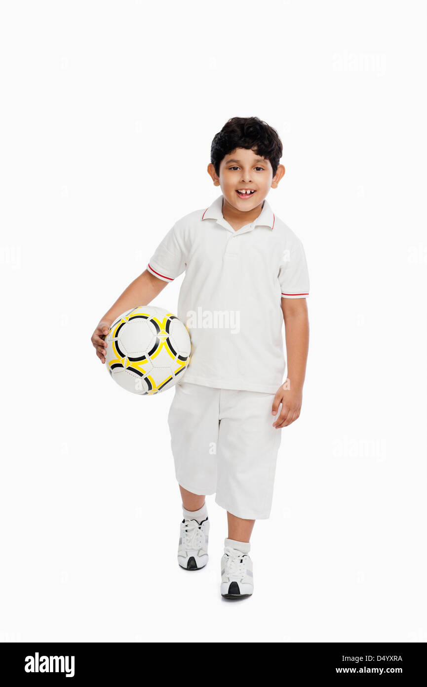 Boy holding a football Stock Photo - Alamy