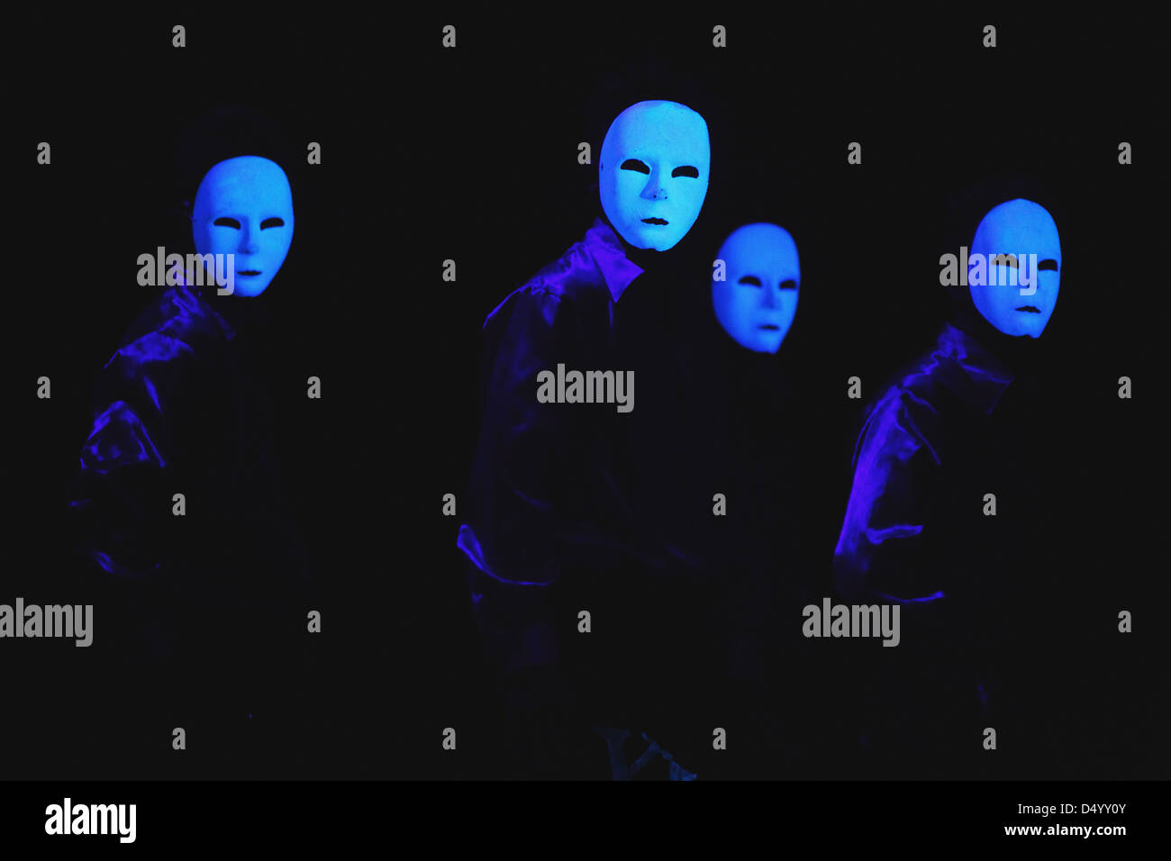 Dancers with white masks Stock Photo - Alamy