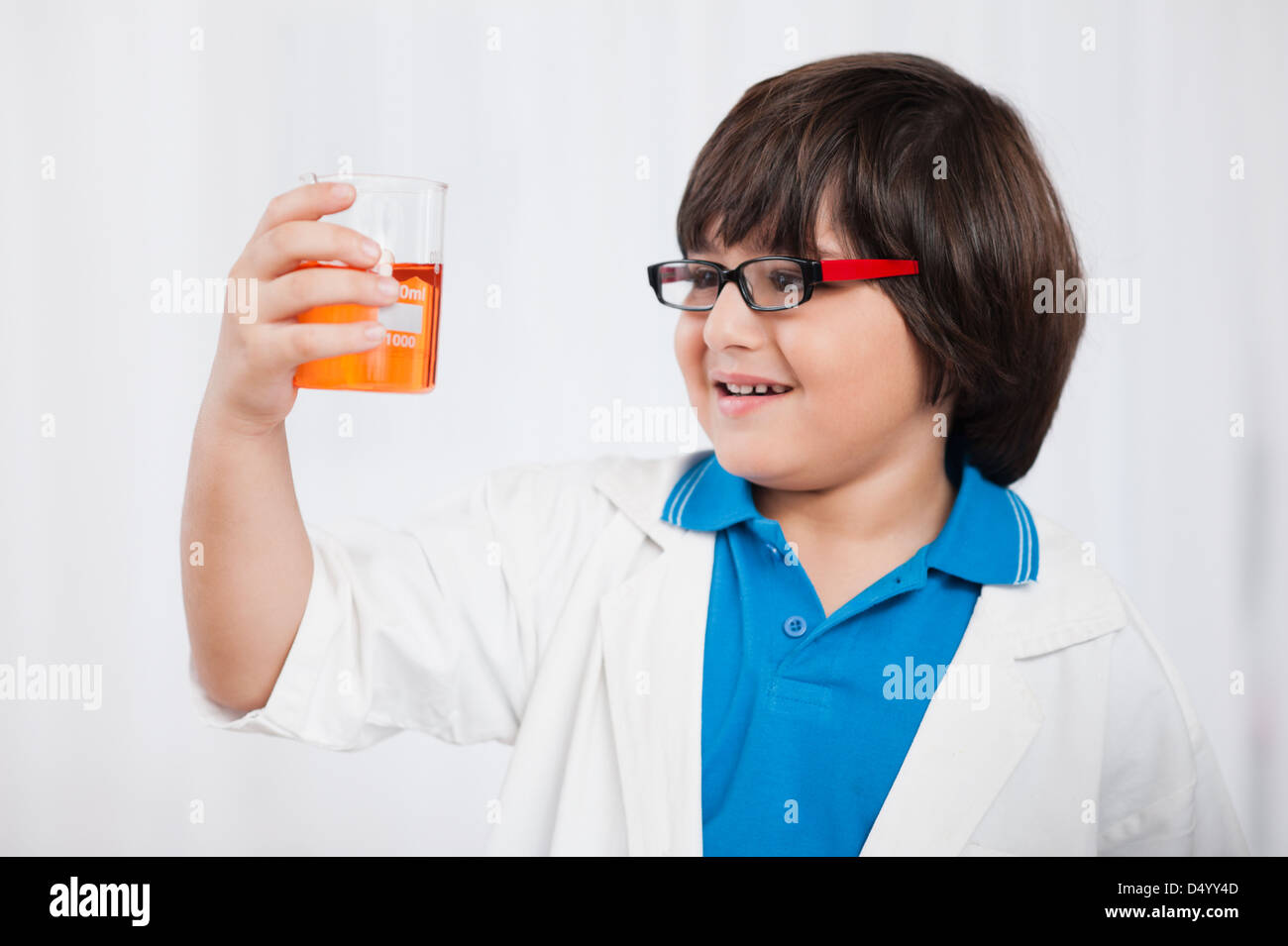 Child scientist looking at beaker hi-res stock photography and images ...