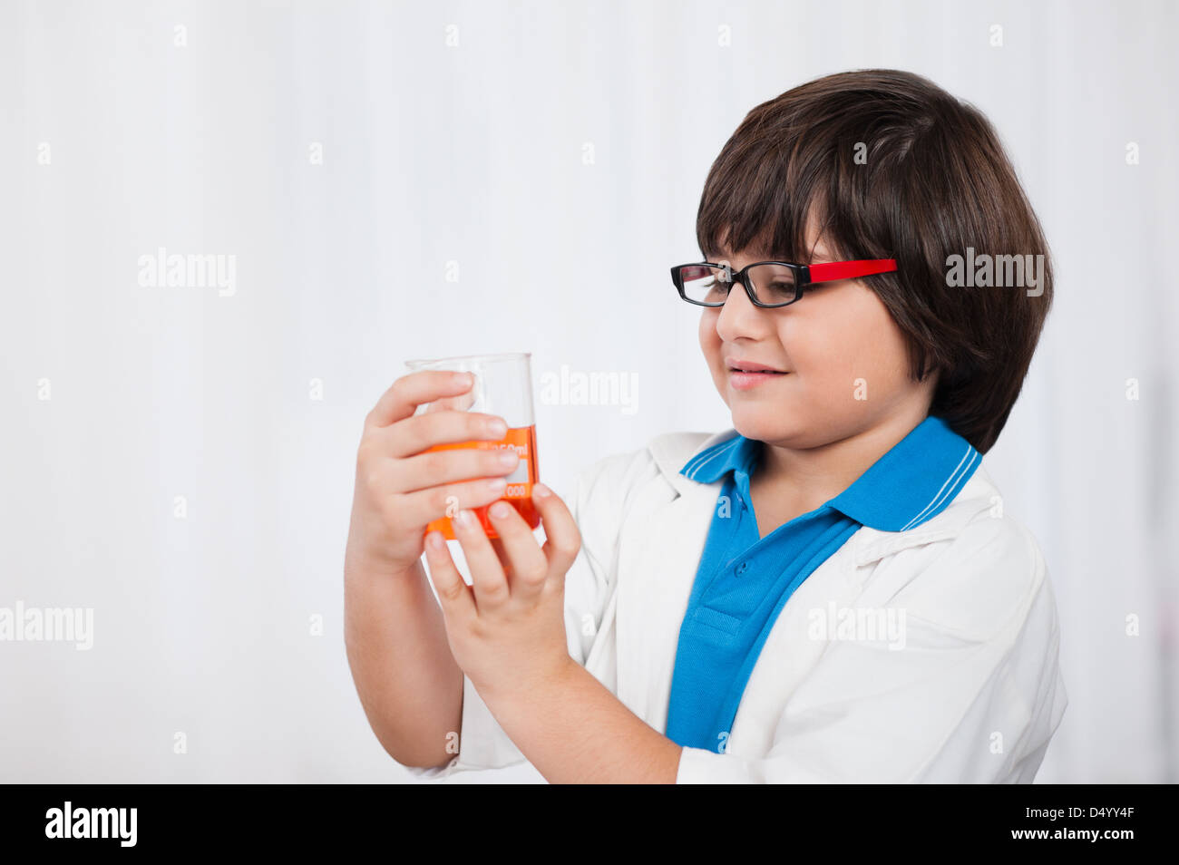 Child scientist looking at beaker hi-res stock photography and images ...