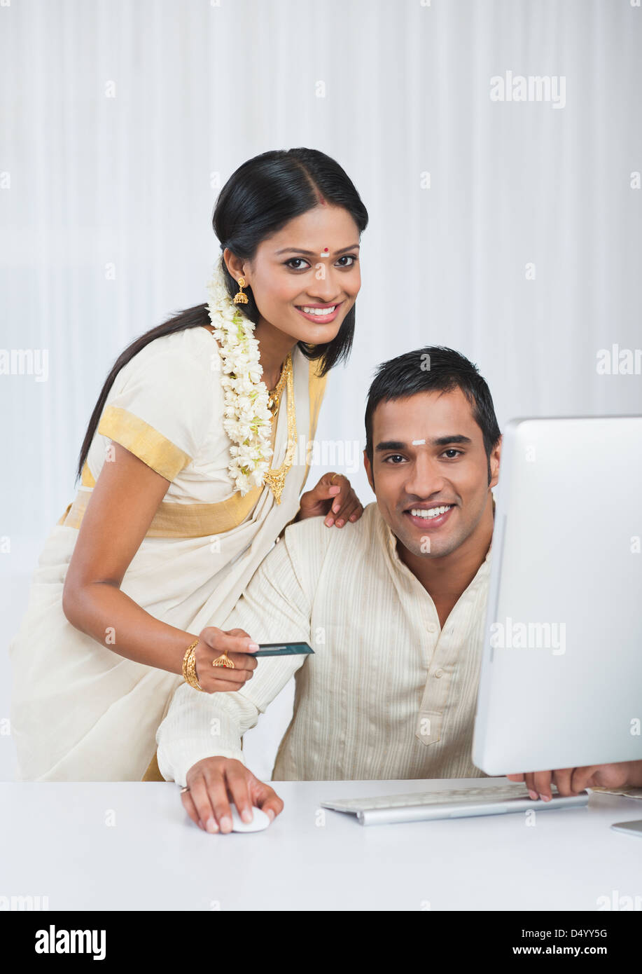 South Indian couple shopping online Stock Photo - Alamy