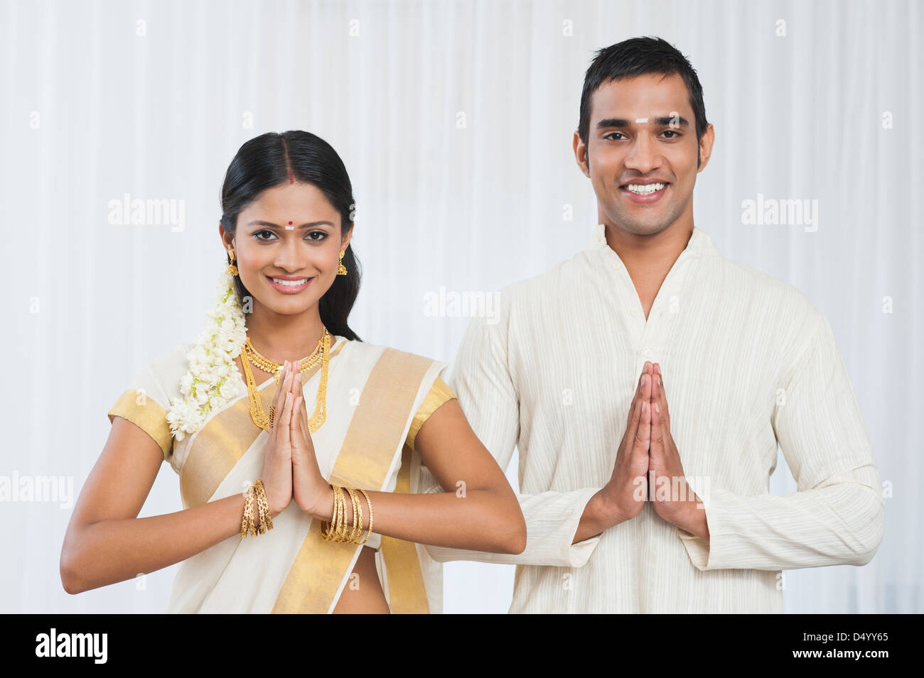 South Indian couple greeting Stock Photo - Alamy