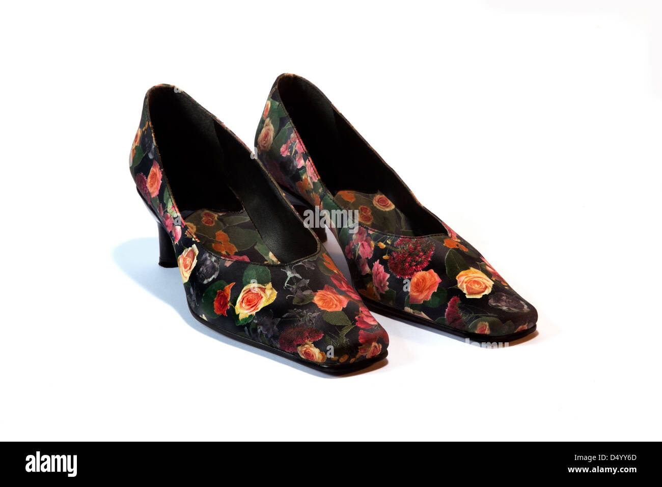 Rose patterned pair of low heeled shoes covered in fabric, very ...