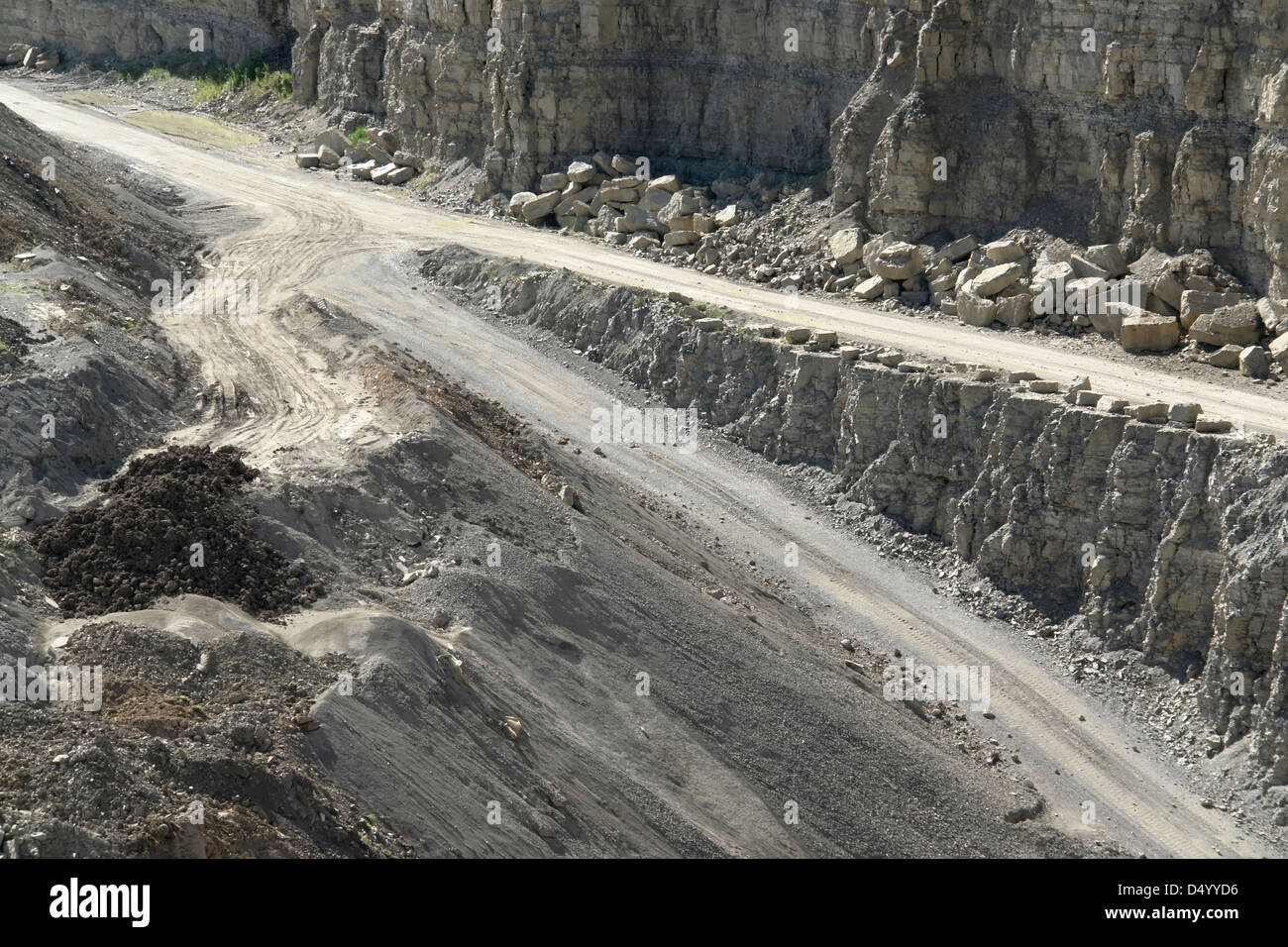 dusty tracks in a quarry in sunny ambiance Stock Photo - Alamy