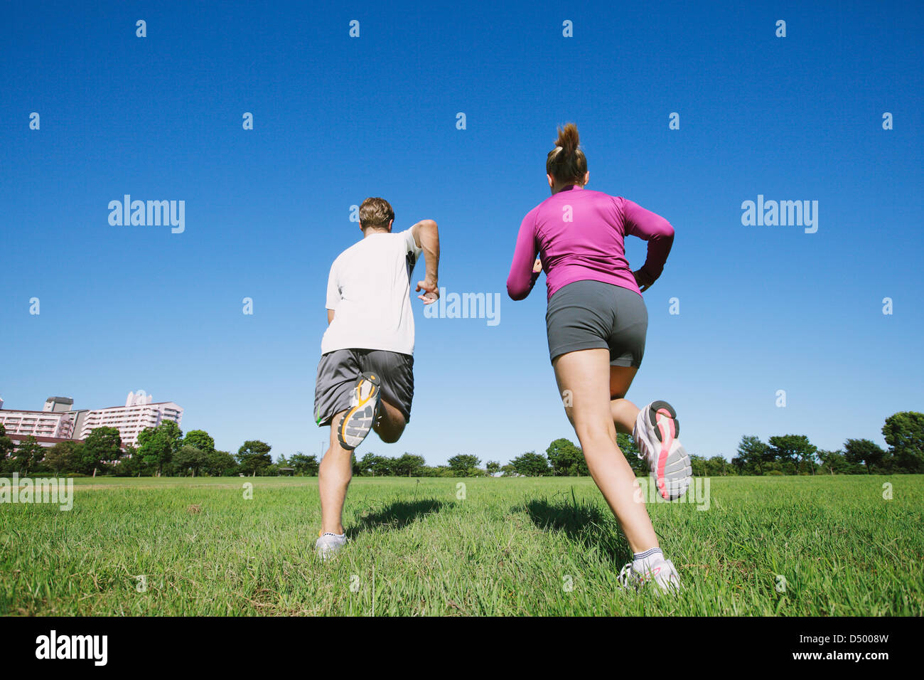 Rear view couple running hi-res stock photography and images - Alamy