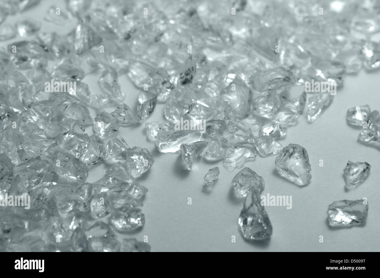 small glass fragments in light back Stock Photo - Alamy