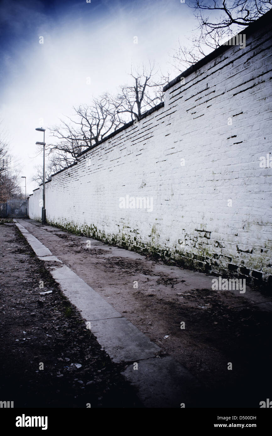 White wall on path Stock Photo - Alamy