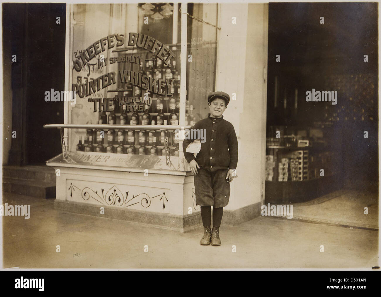 Joseph Bernstein, a 10-year-old newsboy, is pictured selling newspapers ...