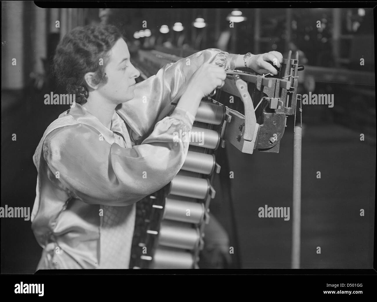 A photograph from 1936 showing the silk production process at William ...