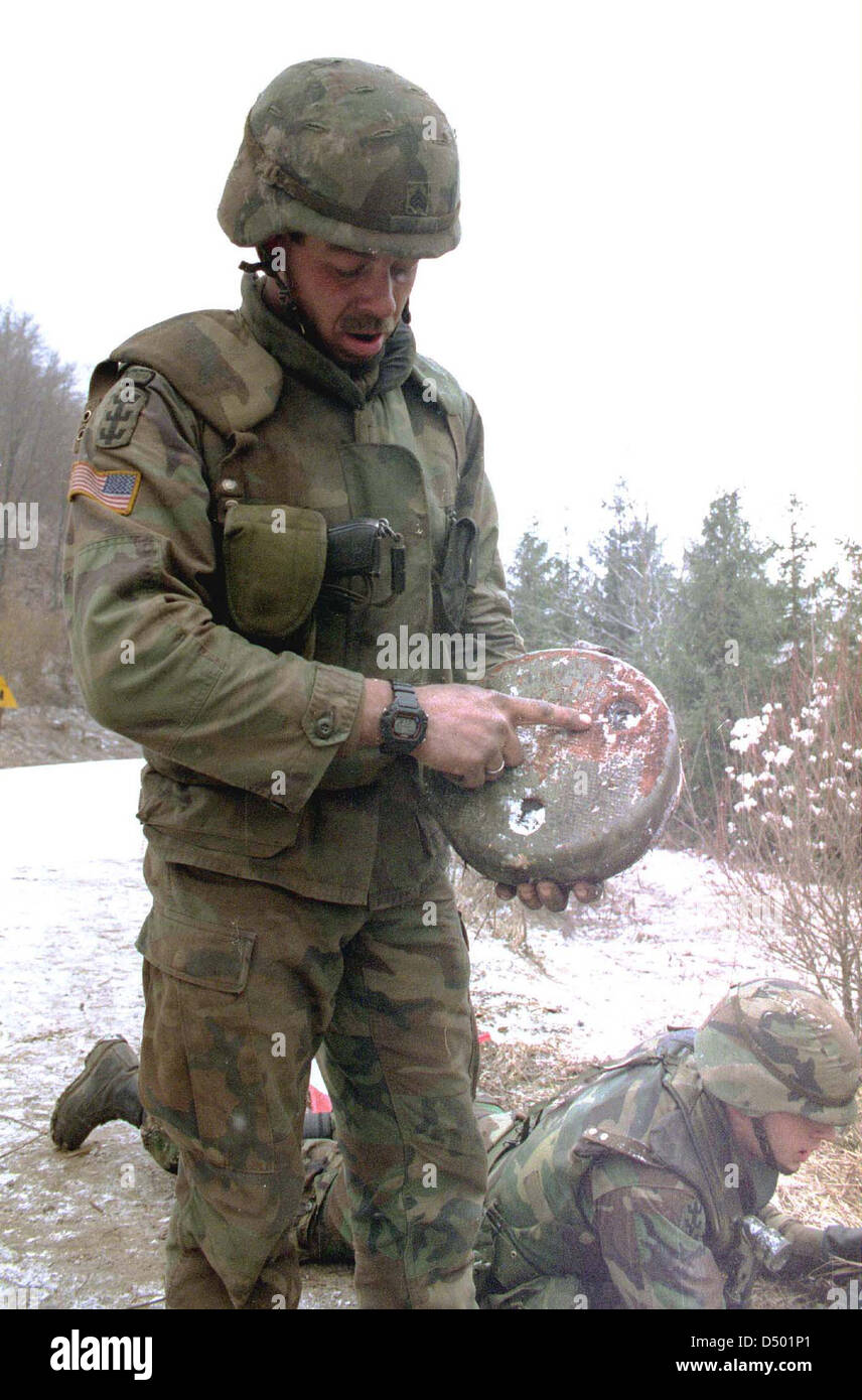 SARAJEVO, BOSNIA, 02 OCTOBER 1998 --- Norwiegan explosive experts remove land mines from a ...