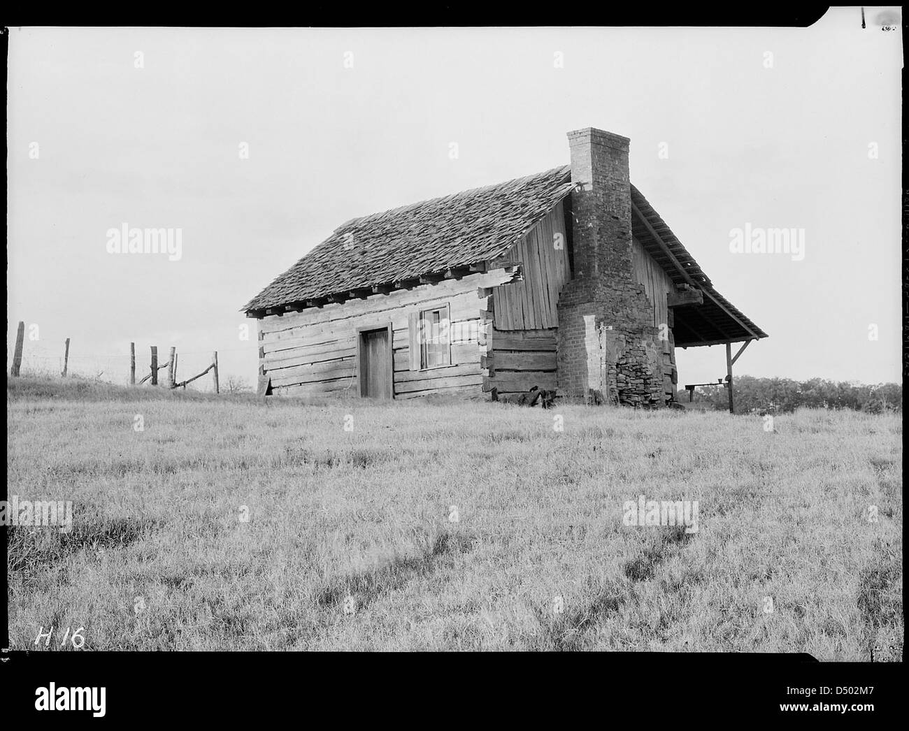 A photograph from October 1933 by Lewis Hine shows a solitary farm home ...