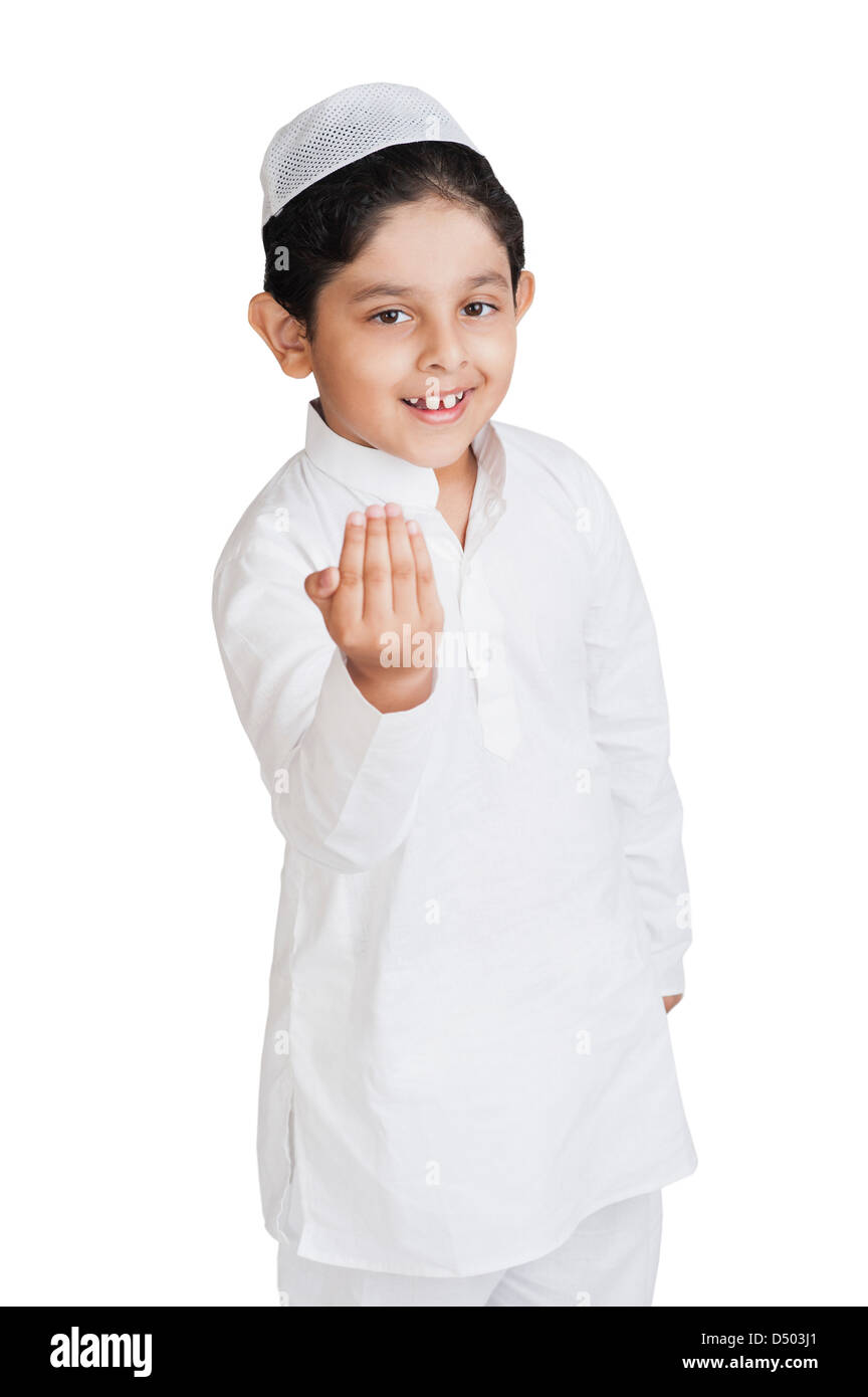 Muslim boy greeting and smiling Stock Photo - Alamy