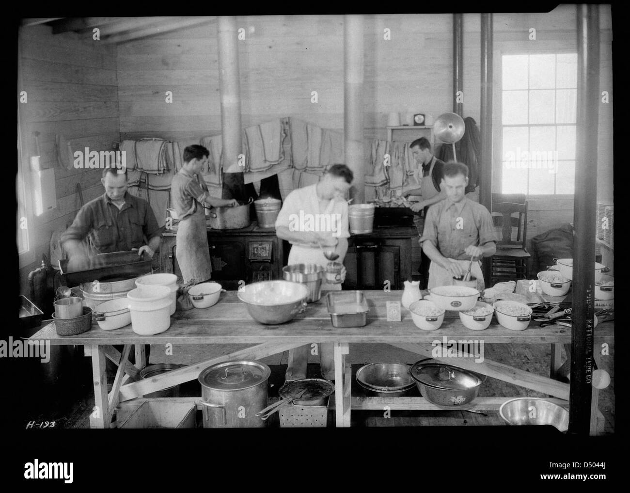 This 1933 image by Lewis Hine shows a temporary kitchen serving as a ...