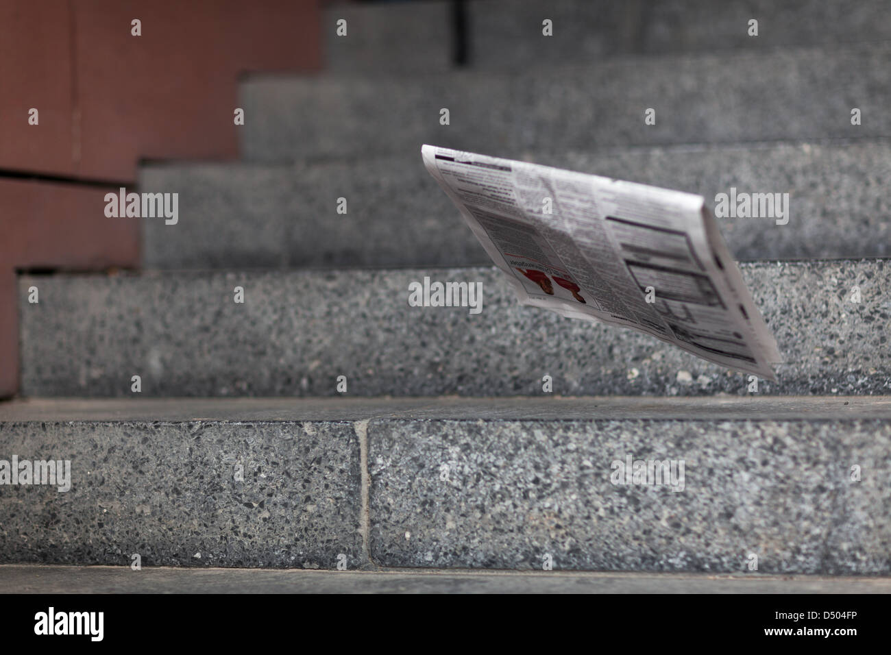 A newspaper is blown in the wind Stock Photo - Alamy