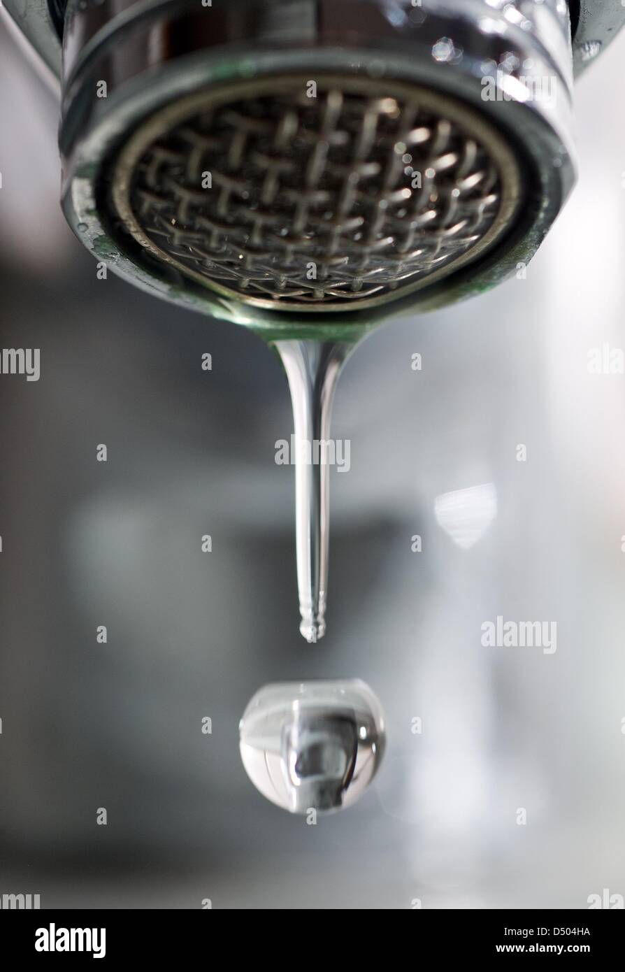 A water drops drips down a tap in Frankfurt (Oder), Germany, 21 March ...