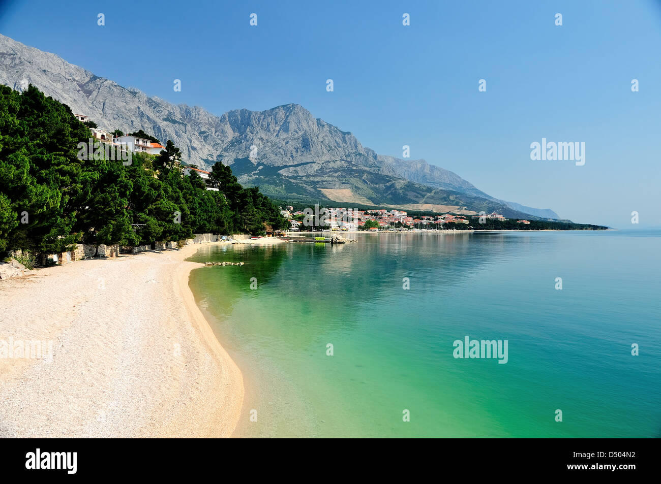 small pebbles beach in brela, croatia with biokovo mountain backgrounds ...