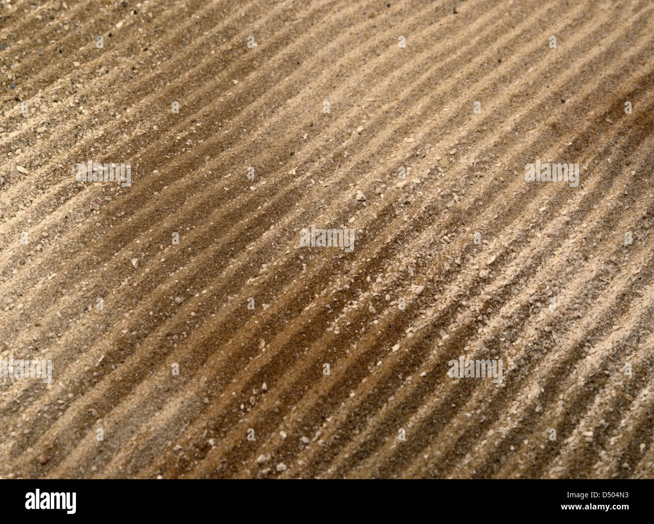 abstract full frame background with diagonal lines in multicolored sand ...