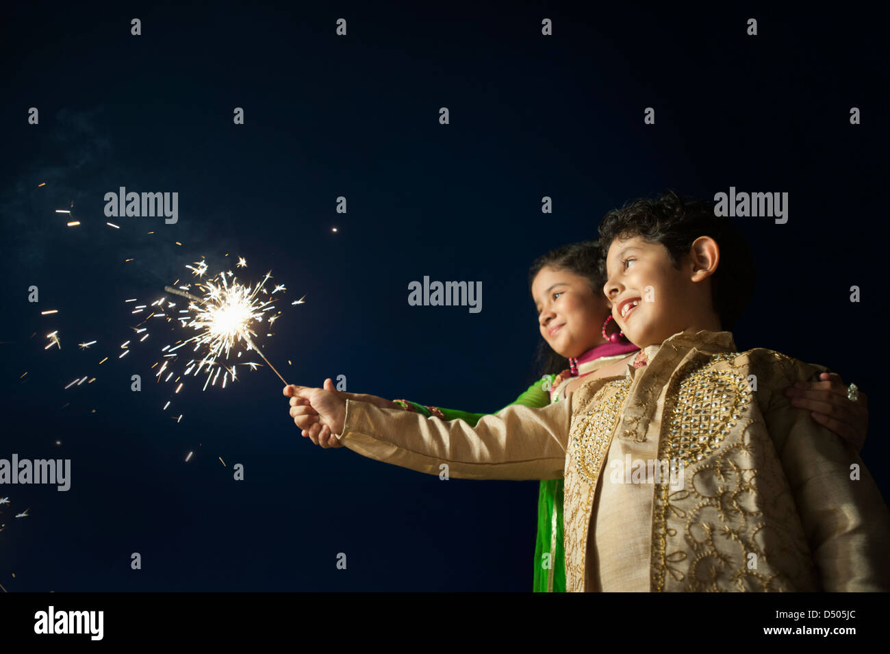 Children burning fire crackers on Diwali Stock Photo, Royalty Free ...