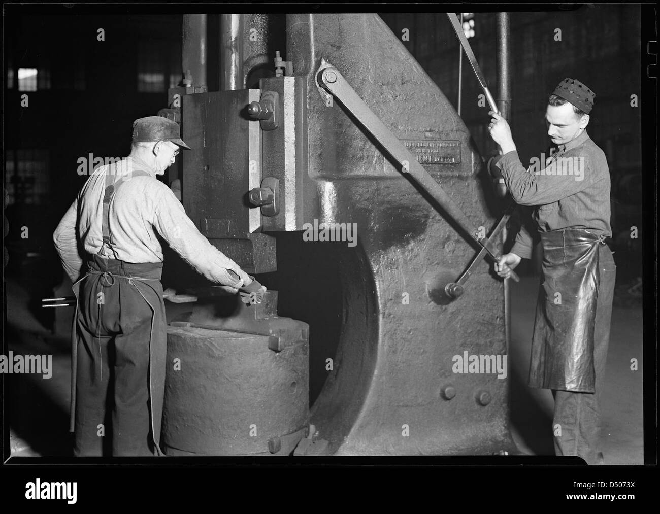 At Baldwin Locomotive Works in March 1937, a blacksmith and helper ...